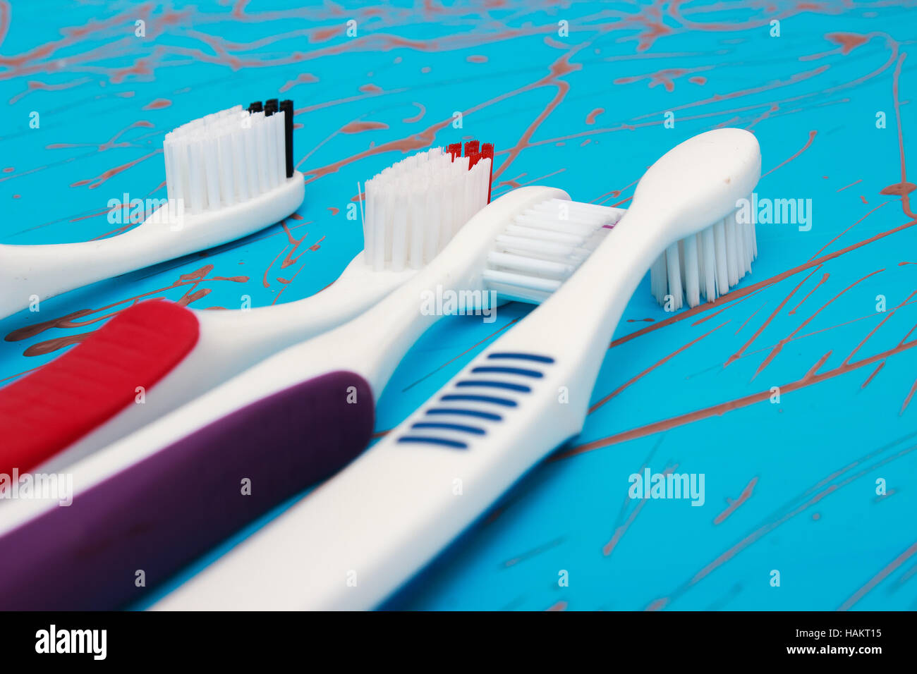 Manual toothbrush set isolated on blue background Stock Photo - Alamy