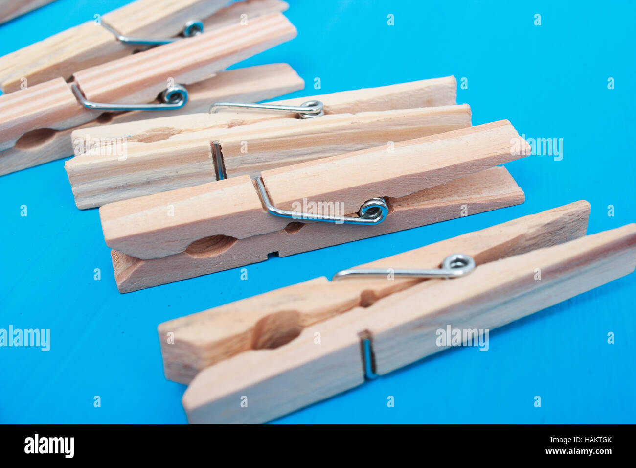 Wooden clothespins on blue hi-res stock photography and images - Alamy