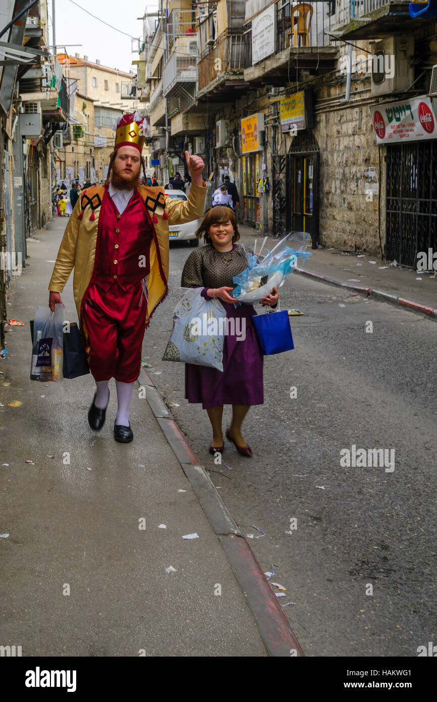 JERUSALEM, ISR - MARCH 25, 2016: Street scene of people carrying ...