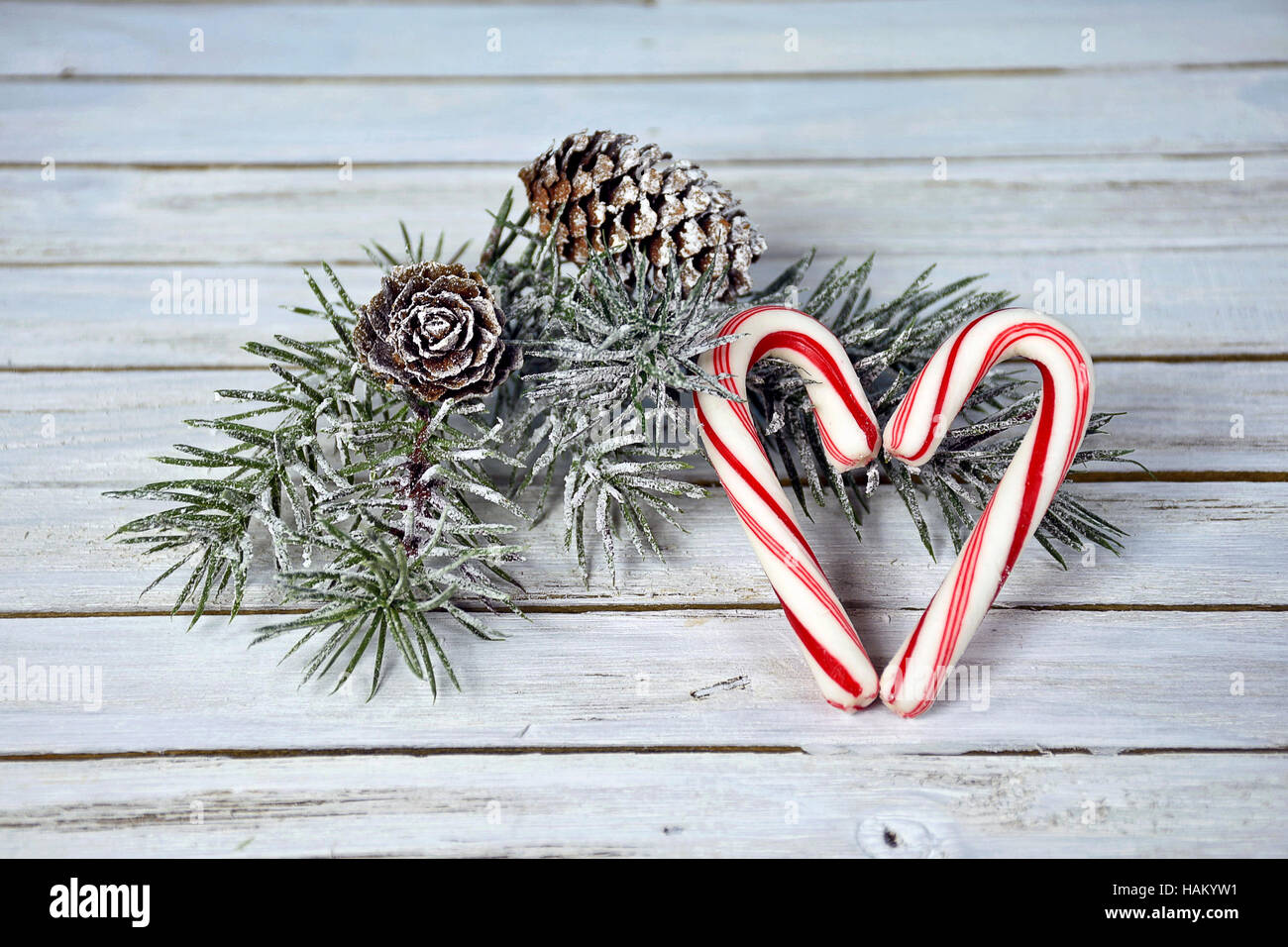 candy cane heart and frosted pine on whitewashed wood Stock Photo - Alamy