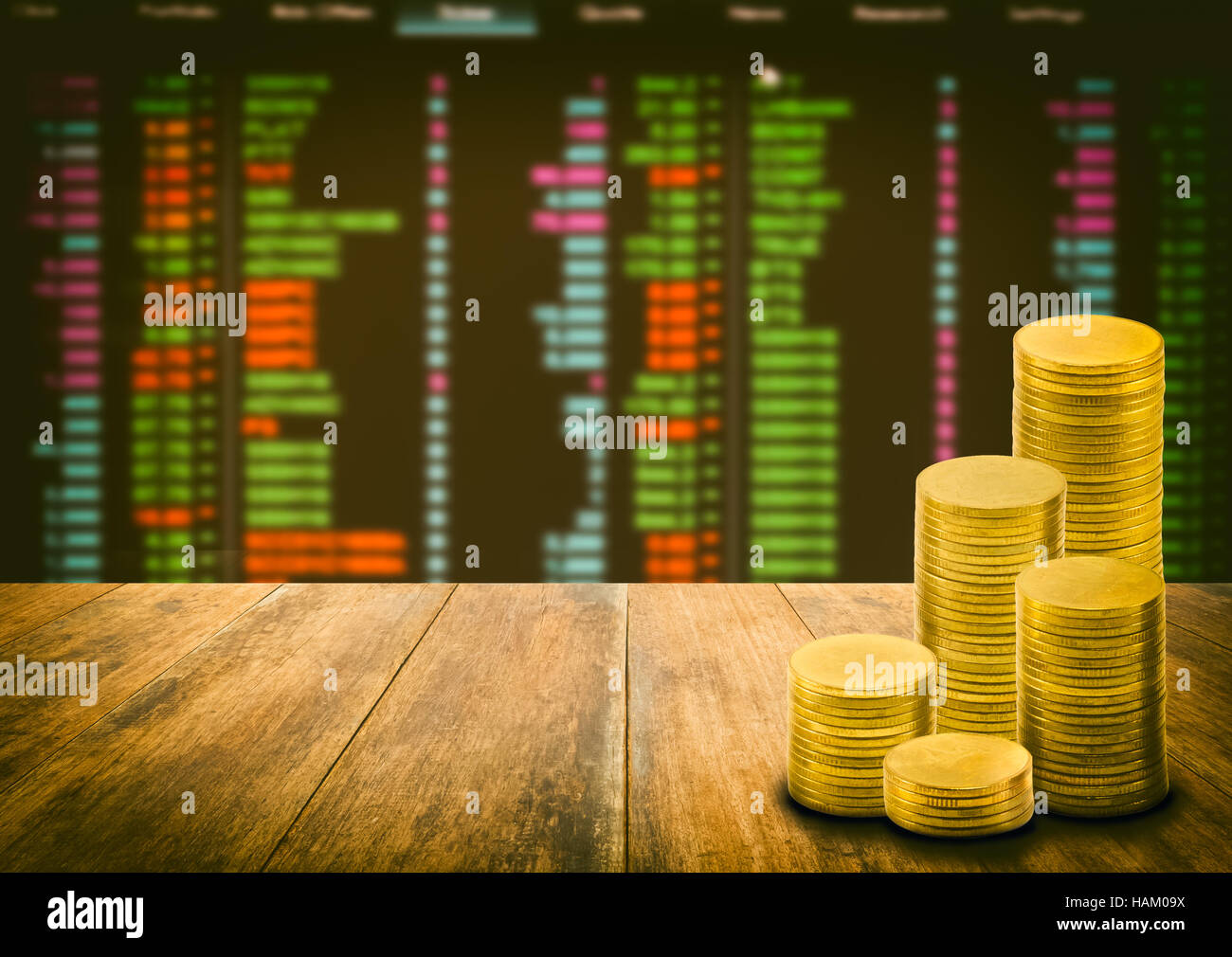 coin stack on wood background with blur stock market background,money ...