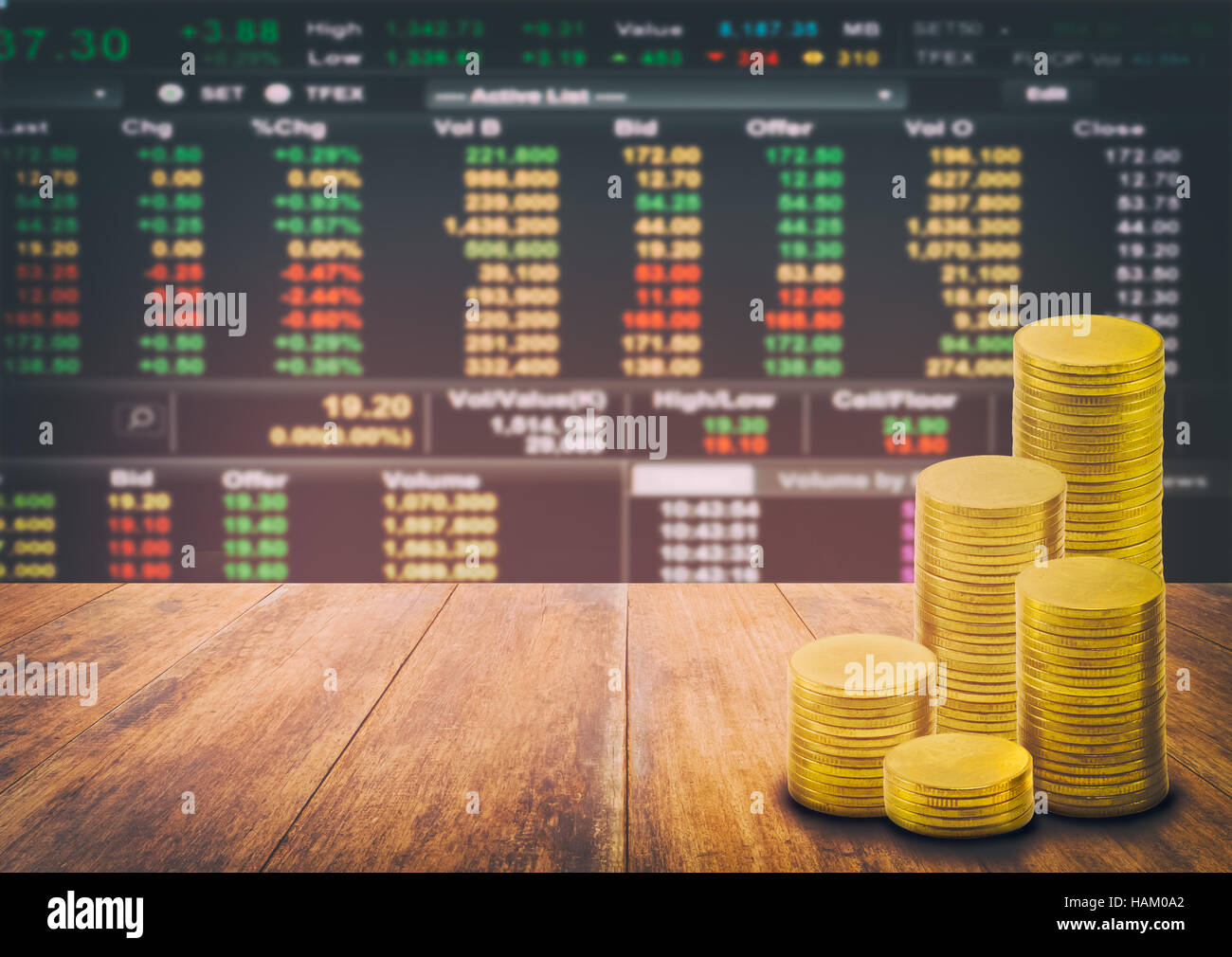 coin stack on wood background with blur stock market background,money ...