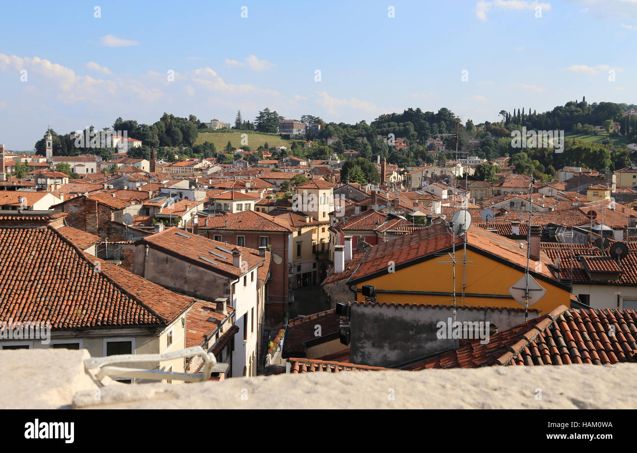 panorama roofs from above of a European city with the hills on ...
