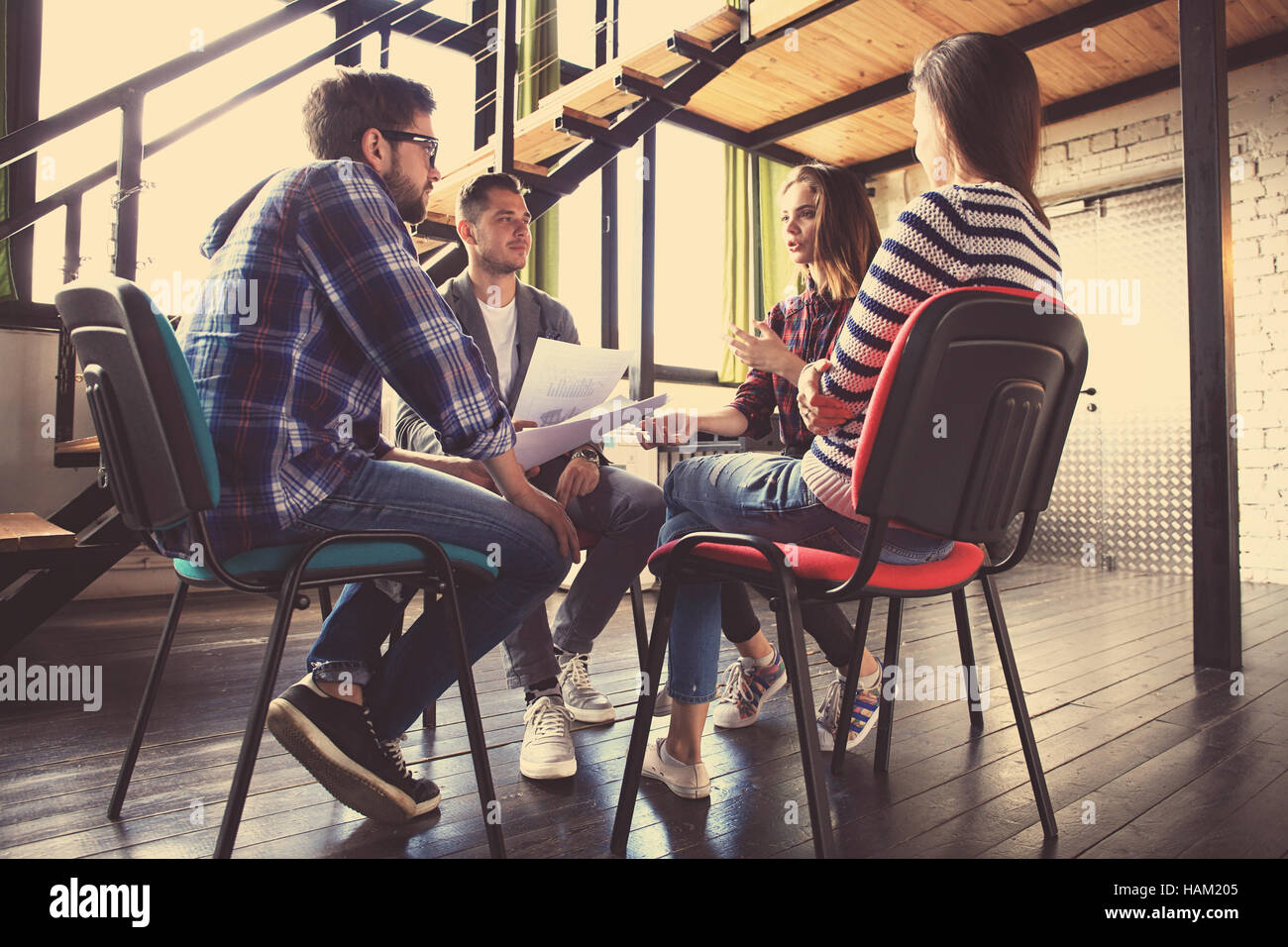Creative business people meeting in circle of chairs Stock Photo - Alamy