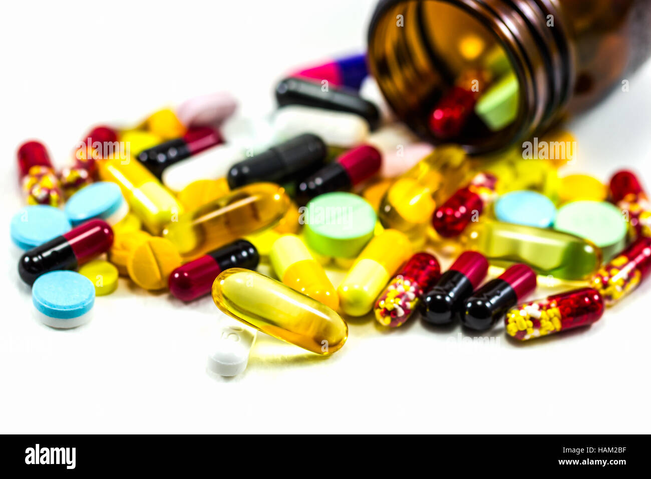 diferent Tablets pills capsule heap mix isolated on white background ...
