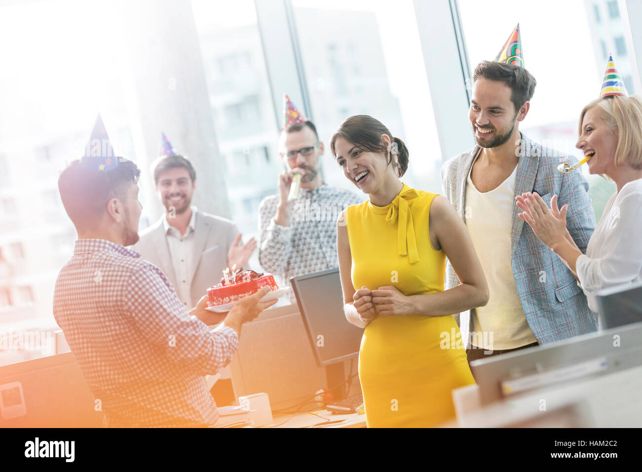 Business people celebrating birthday with cake in office Stock Photo ...