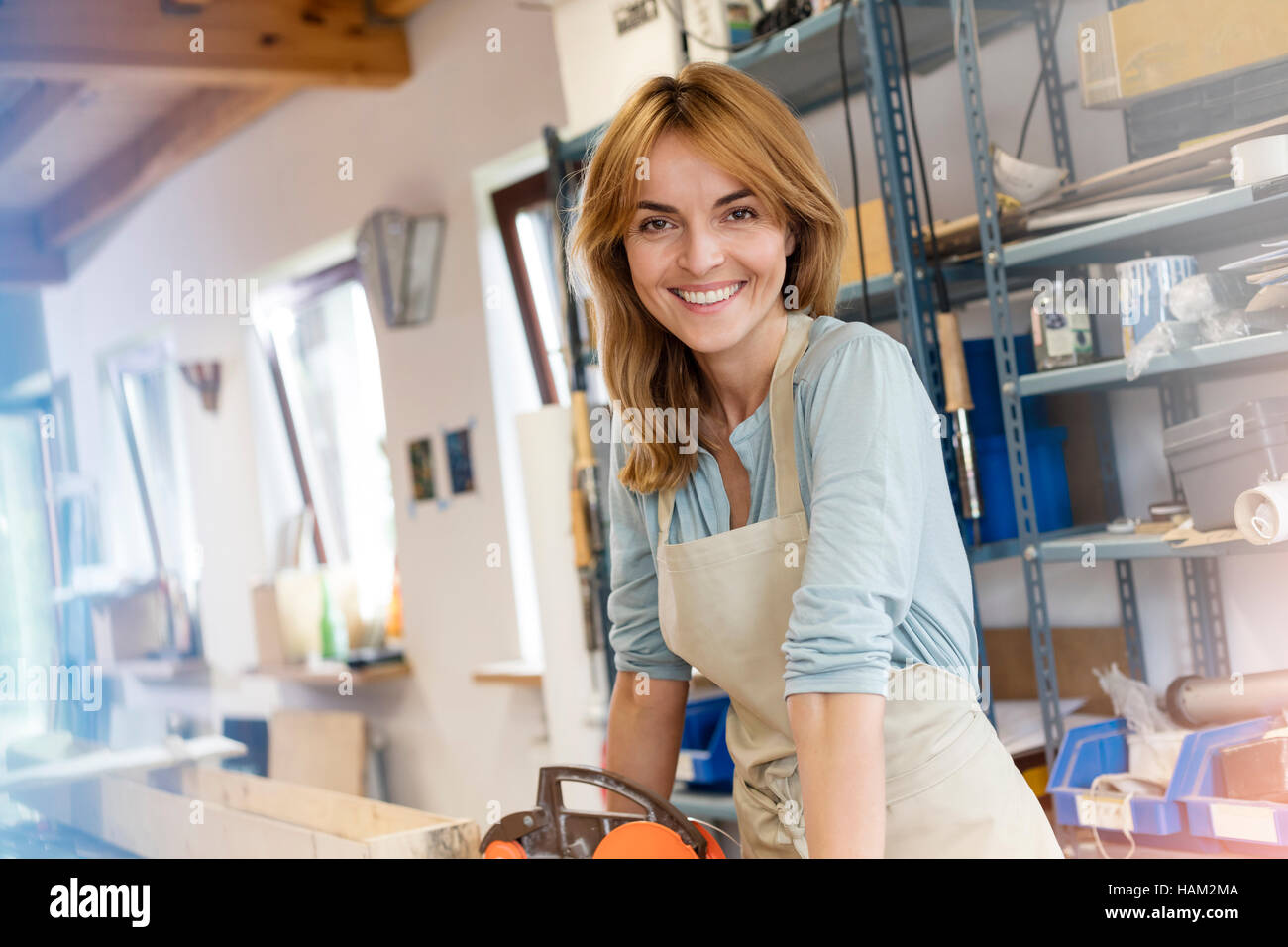Portrait smiling artist in studio Stock Photo - Alamy