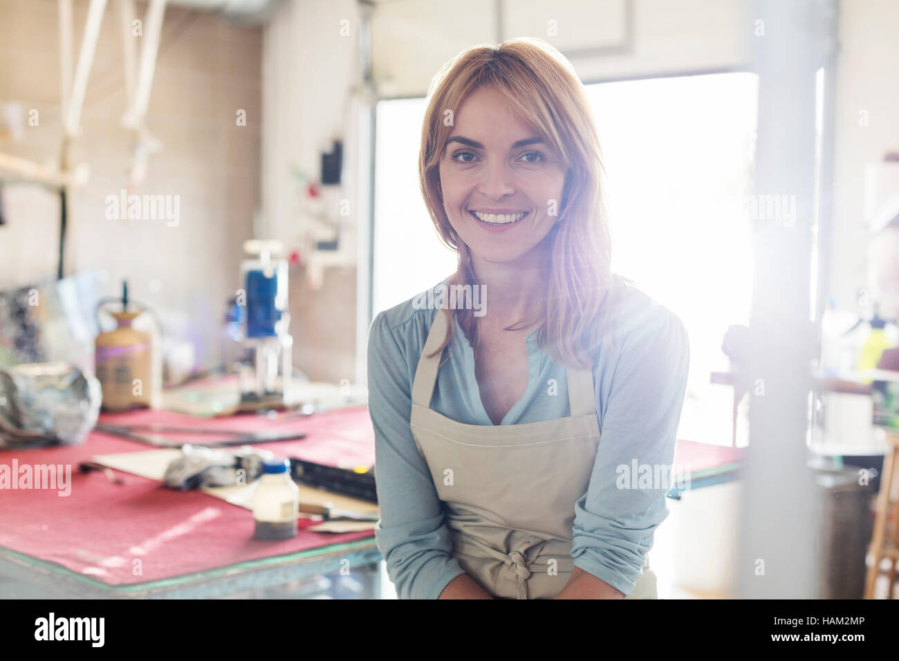 Portrait smiling artist in studio Stock Photo - Alamy