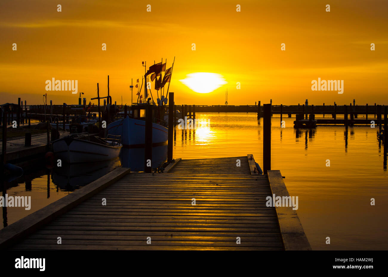 Sunset at the old harbor. Shot in Denmark Stock Photo - Alamy