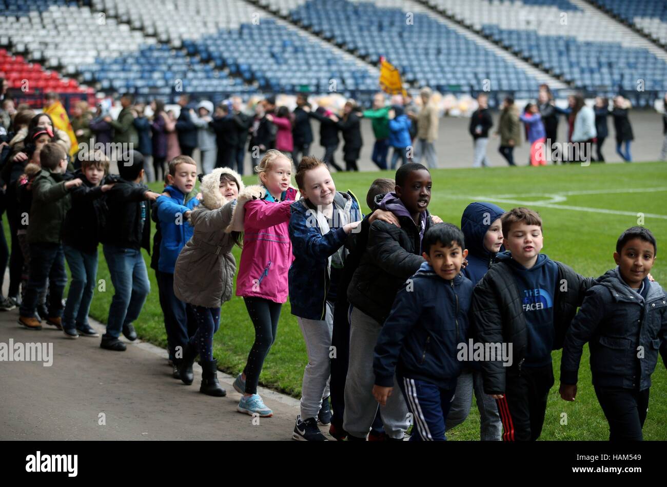Hundreds of school children, and their teachers, join a giant conga ...