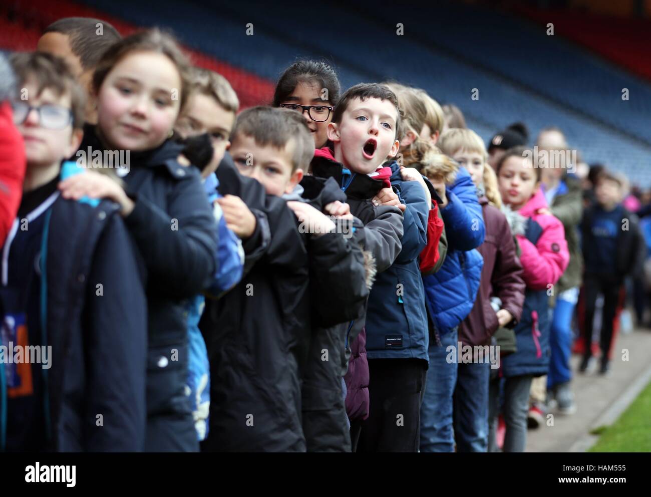 Hundreds of school children, and their teachers, join a giant conga ...
