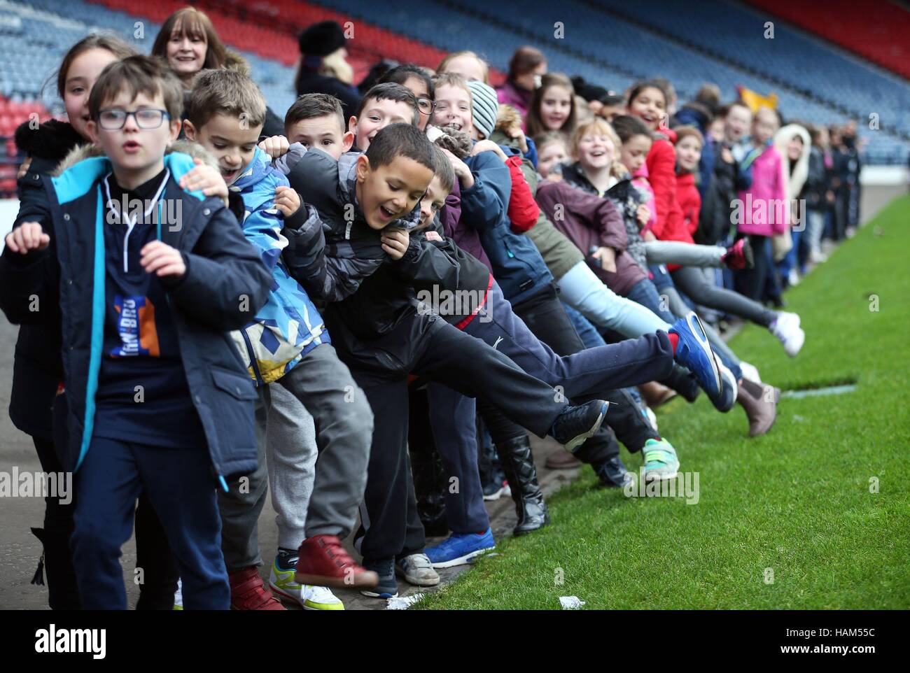 Hundreds of school children, and their teachers, join a giant conga ...