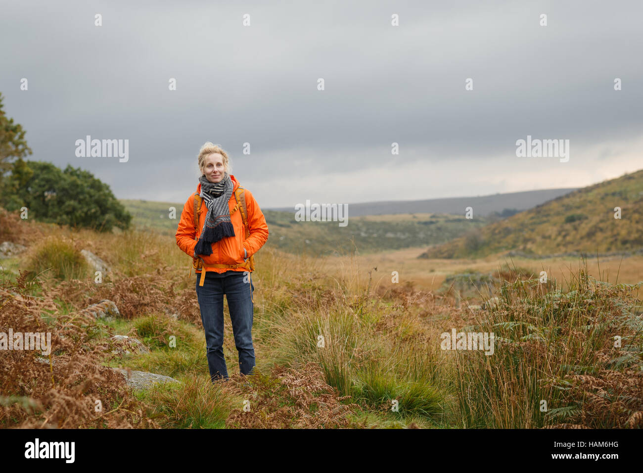 A woman hiking in the countryside Stock Photo - Alamy