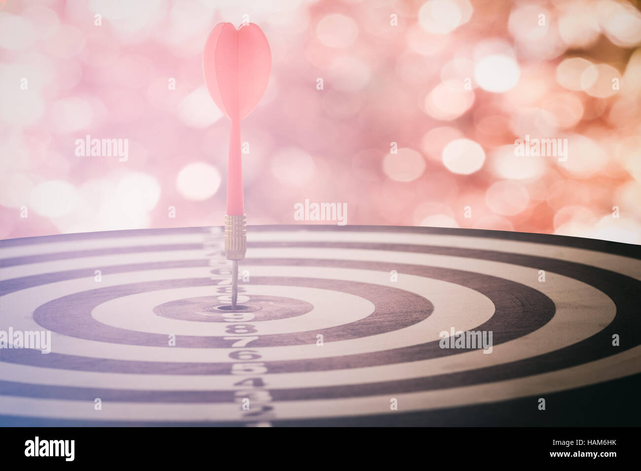 target dart with target arrows on the bokeh background and dartboard is ...