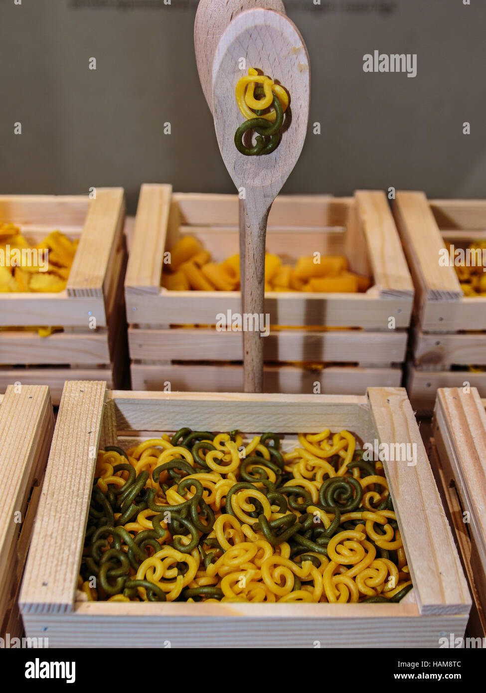 White and Green Italian Pasta in Wooden Box with Brown Ladle Stock ...
