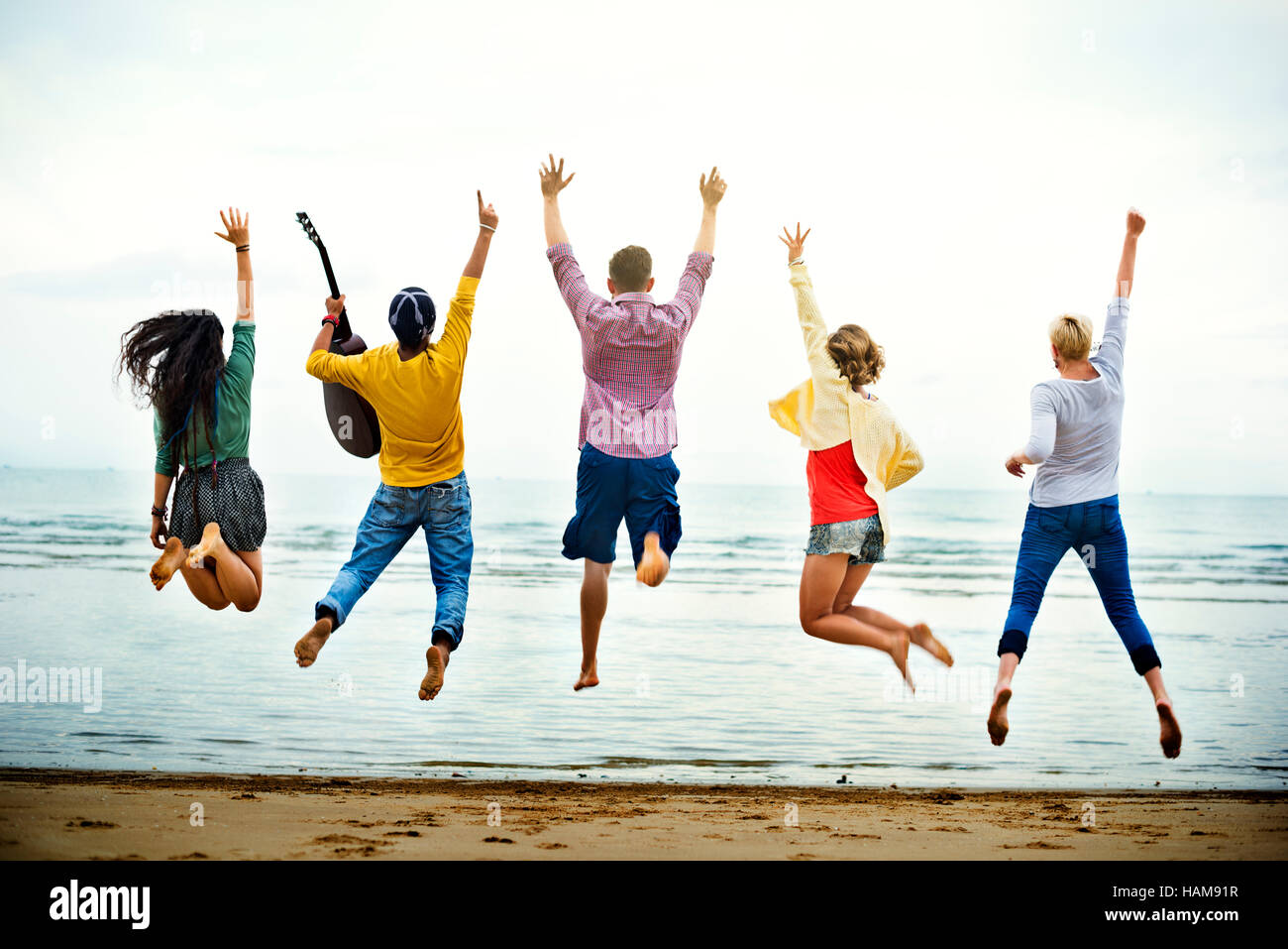 Group Of People Jumping Concept Stock Photo - Alamy