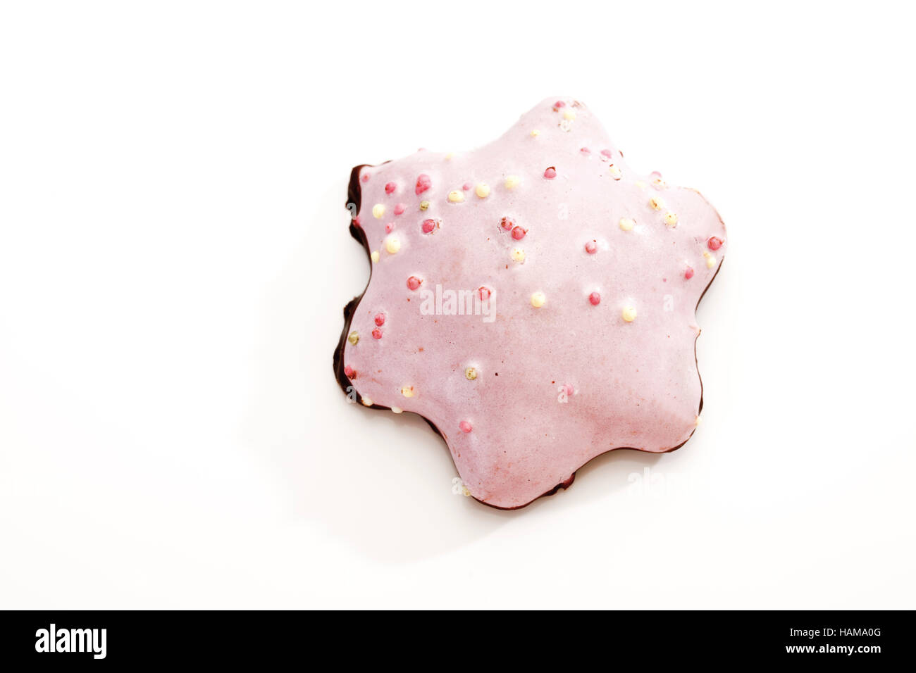 Sugar glazed gingerbread star biscuit with sugar pearls Stock Photo - Alamy