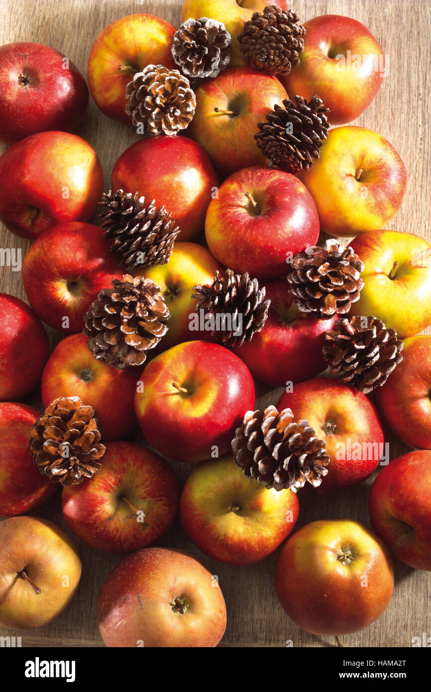 Apples and pine cones Stock Photo - Alamy