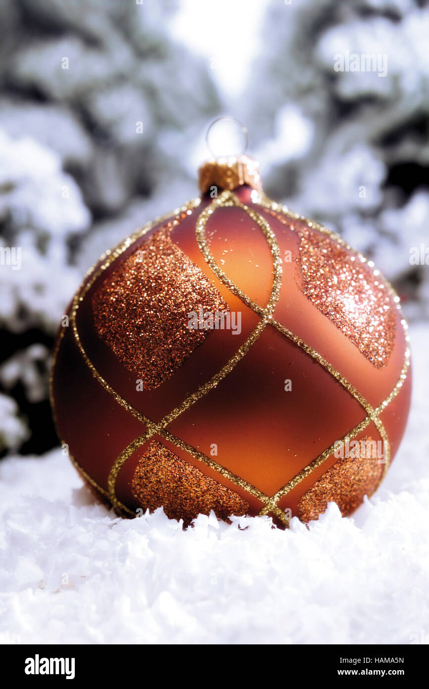 Christmas tree bauble in a snowy forest Stock Photo - Alamy