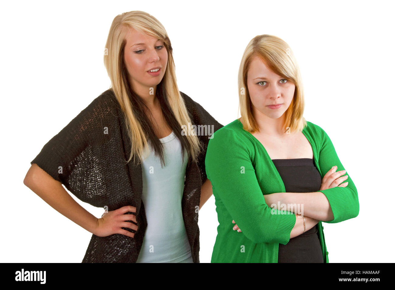 Two woman friends have an argue with each other- isolated on white ...