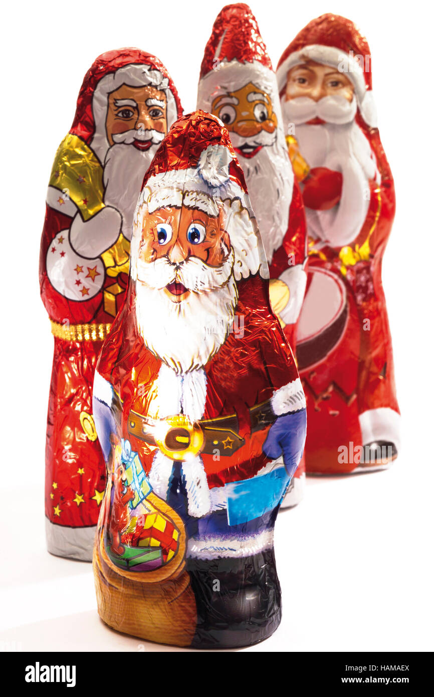 Four chocolate Santa Claus figures Stock Photo - Alamy