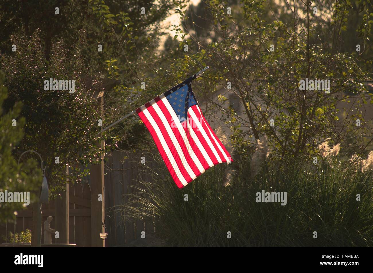 An American flag hanging high overhead Stock Photo - Alamy