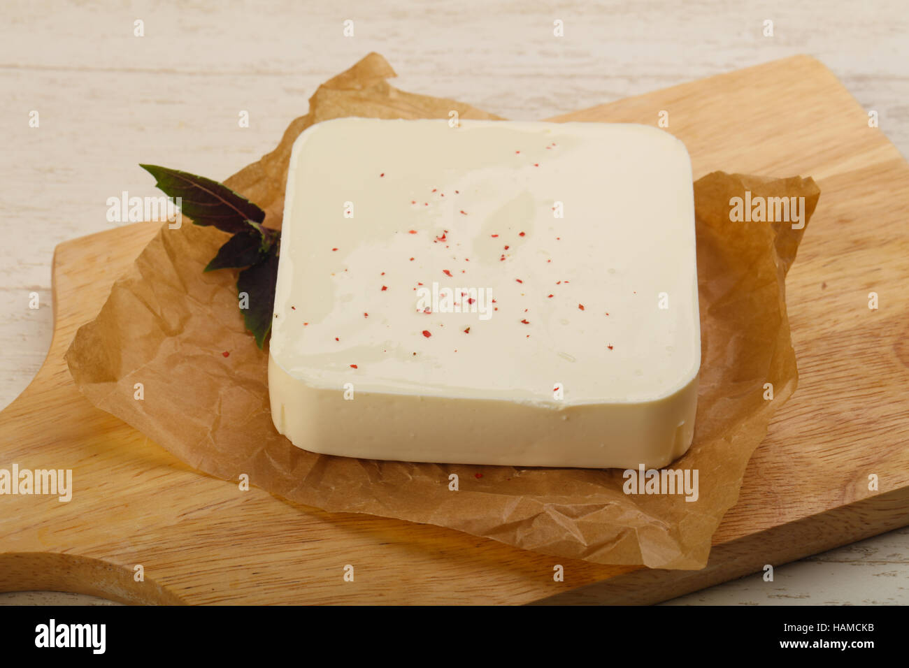 Traditional Feta cheese on the wooden background Stock Photo - Alamy