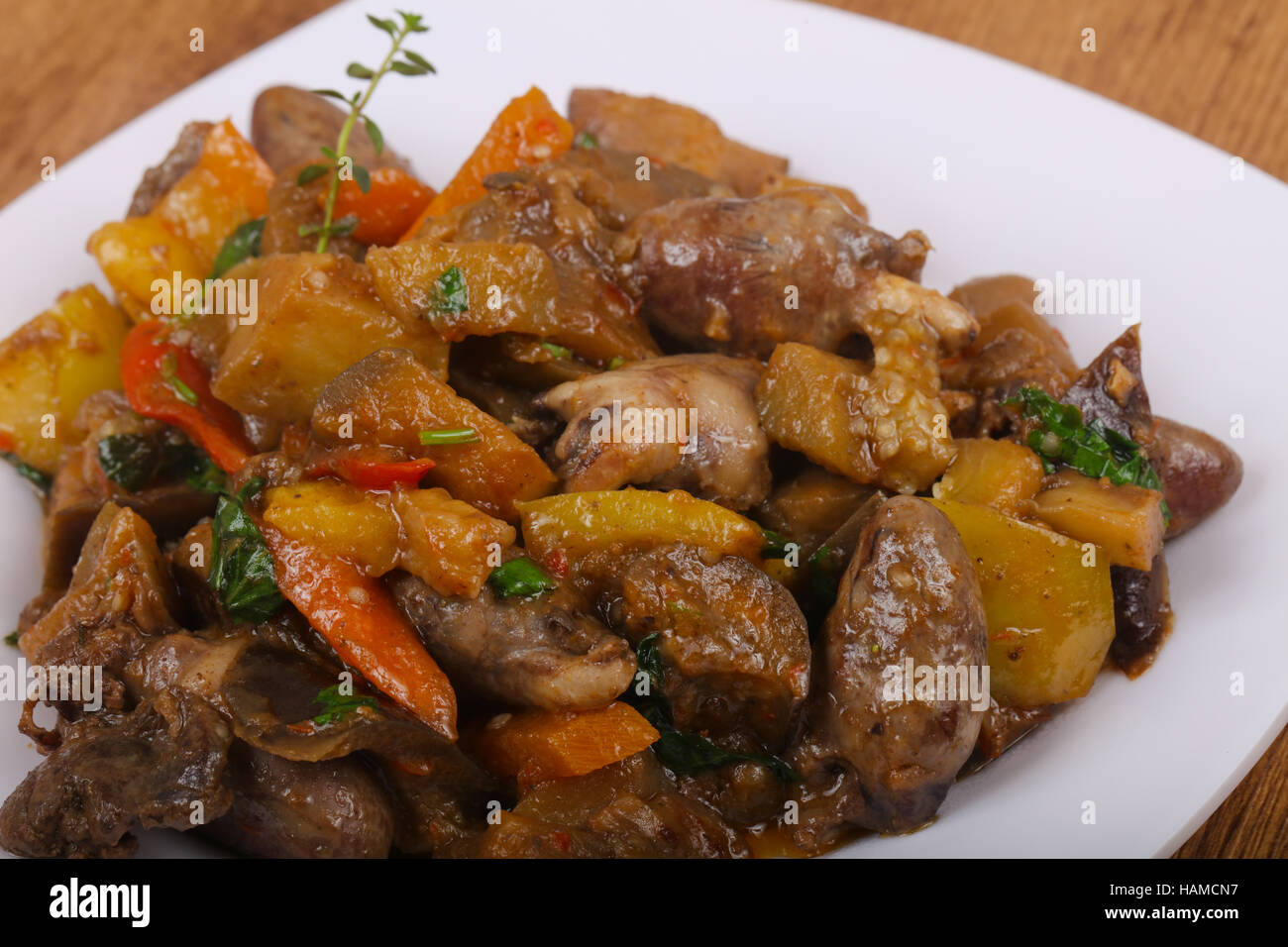 Chicken hearts with vegetables - eggplant, tomato and pepper Stock ...