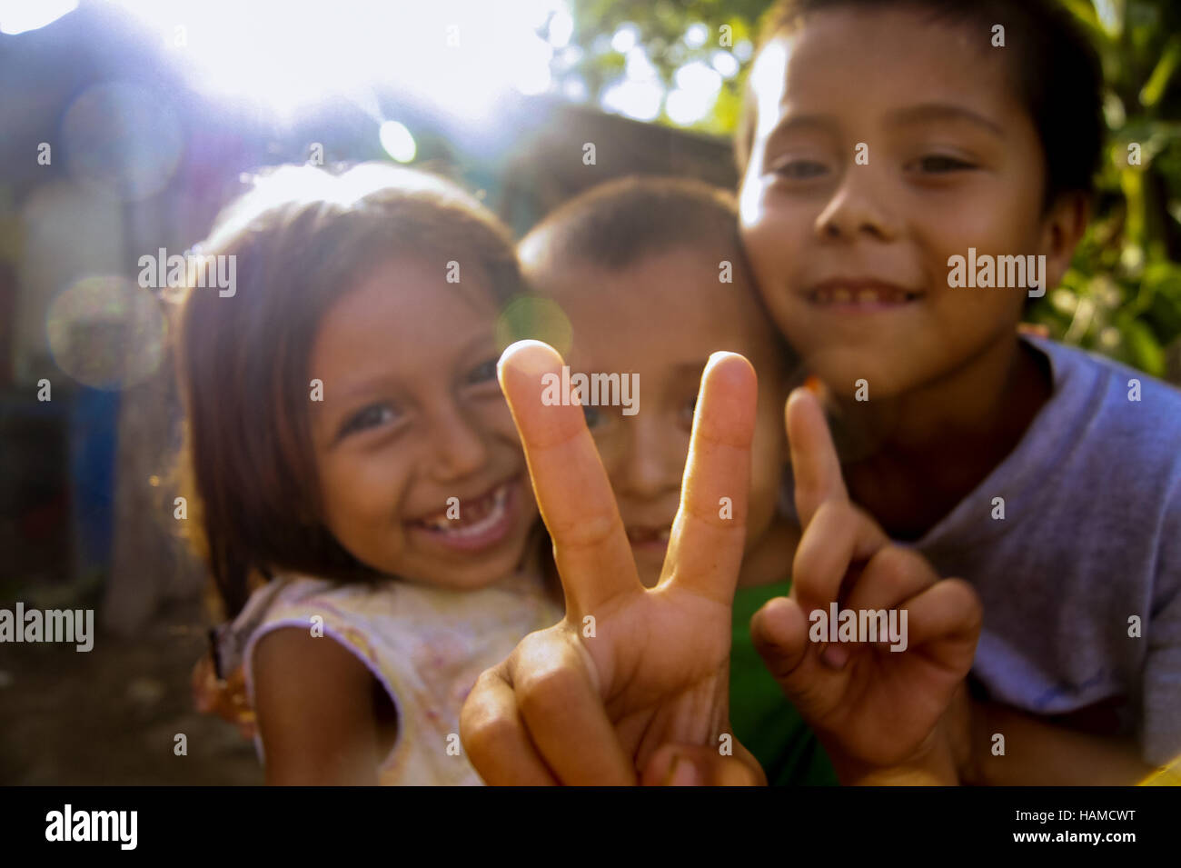 Honduras: Playful, happy children giving the Peace sign Stock Photo - Alamy