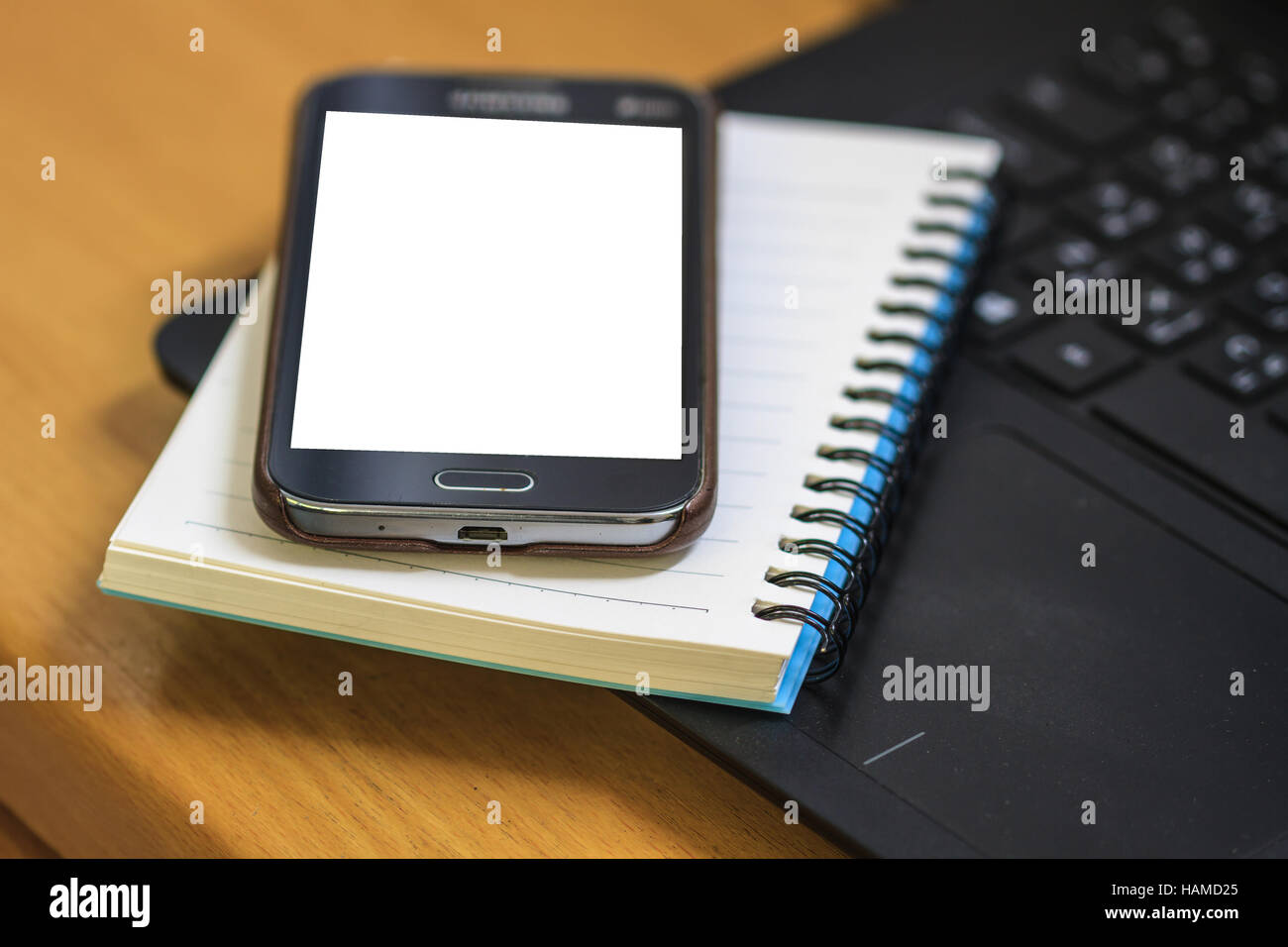 Laptop with book and smartphone on work desk Stock Photo - Alamy