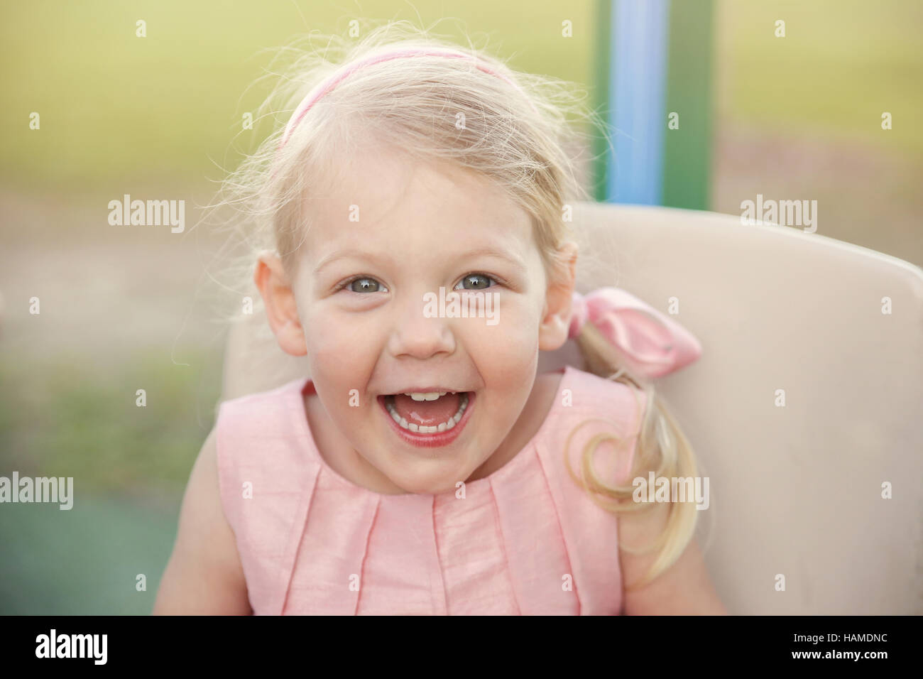 Happy little girl in the park Stock Photo - Alamy