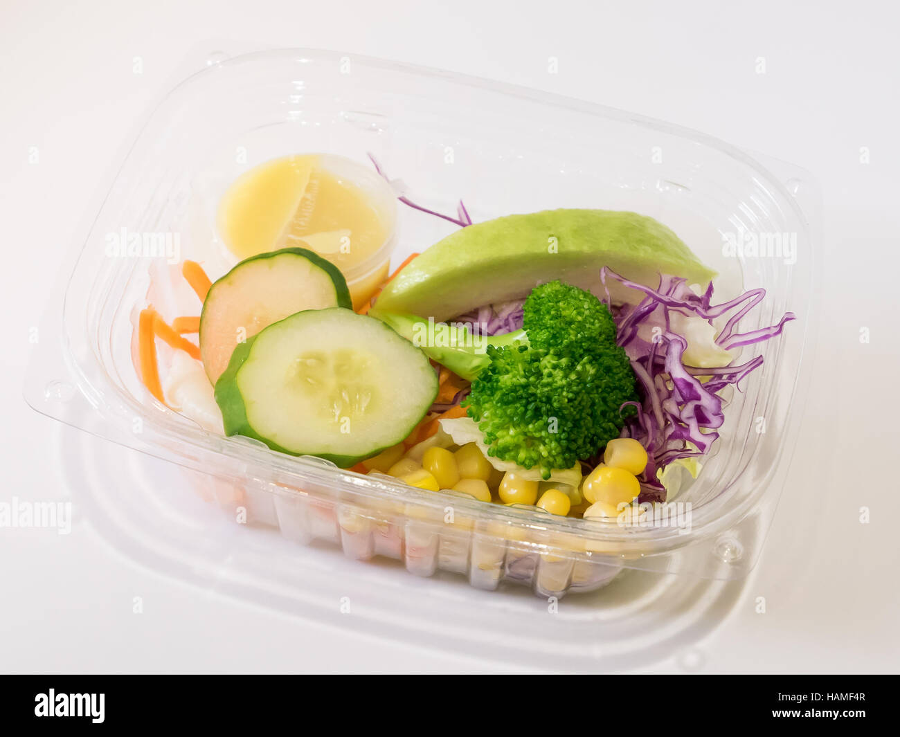 The close up of fresh salad set in the clear plastic box Stock Photo ...
