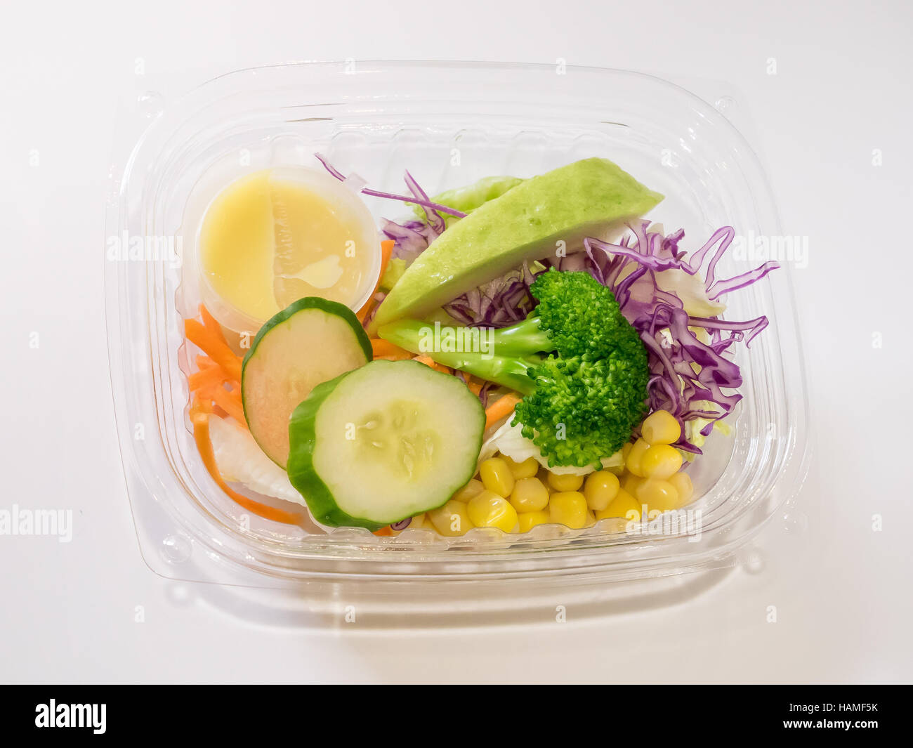 The close up of fresh salad set in the clear plastic box Stock Photo ...