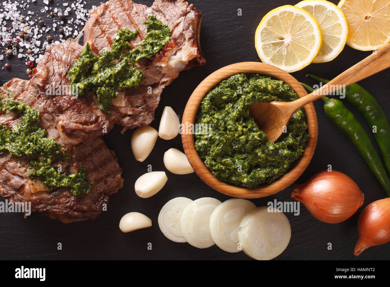 Argentine cuisine: grilled beef steak with chimichurri sauce macro on ...