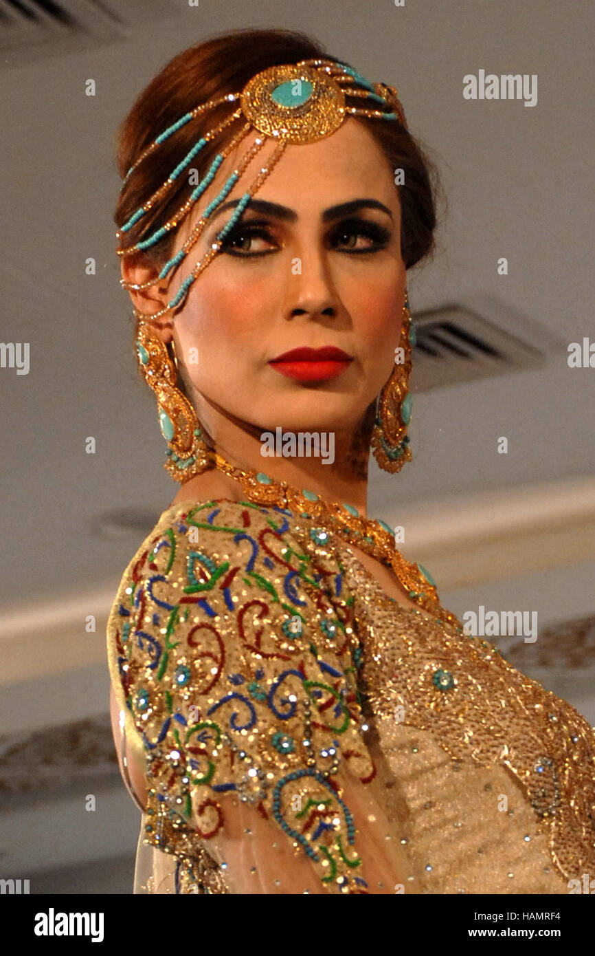 Lahore. 1st Dec, 2016. A model presents a creation of designer Nazish ...