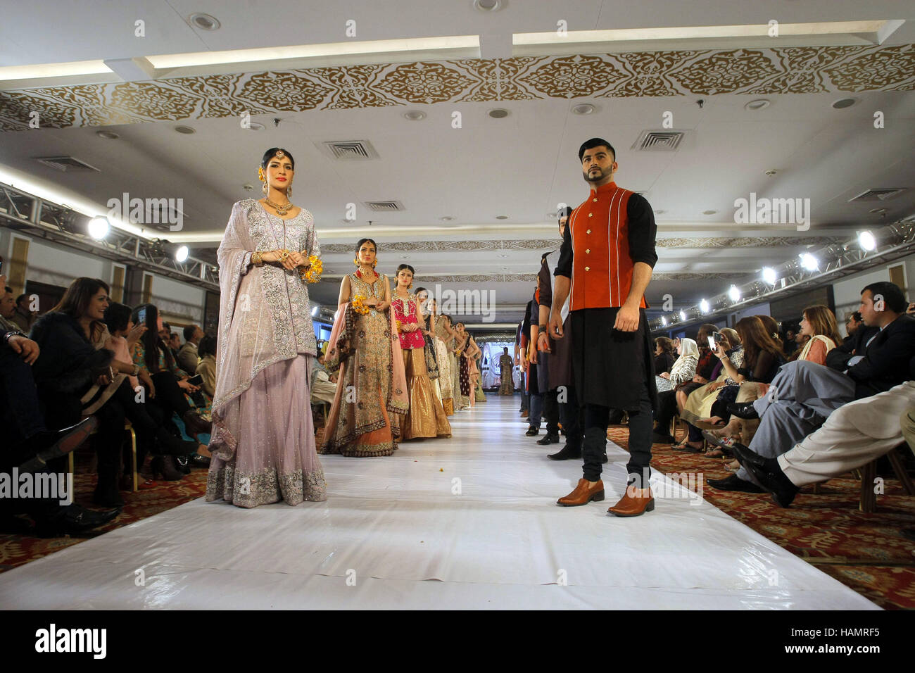 Lahore. 1st Dec, 2016. Models present creations of designer Zahid ...