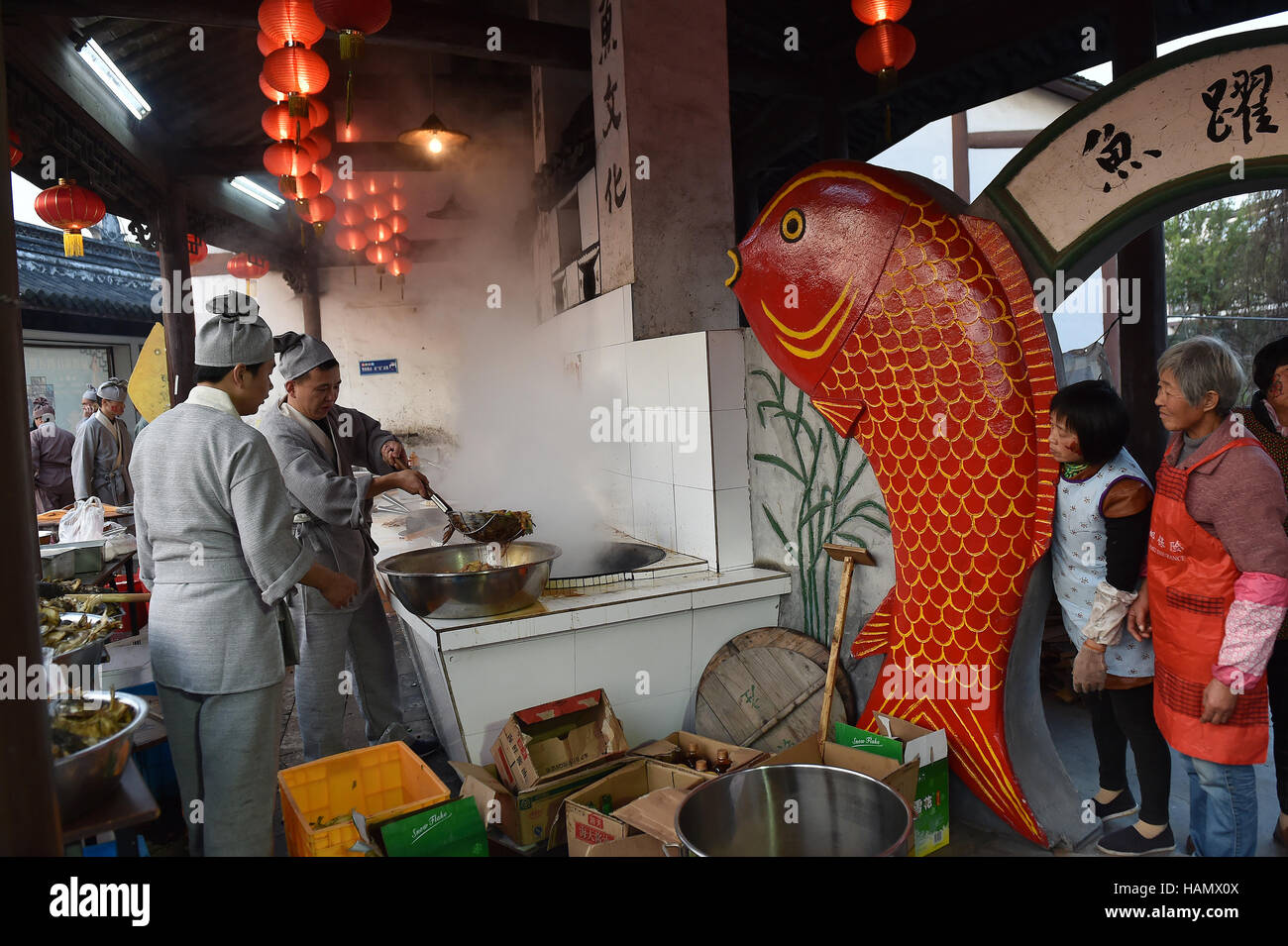 Huzhou, China's Zhejiang Province. 2nd Dec, 2016. Cooks make fish ...