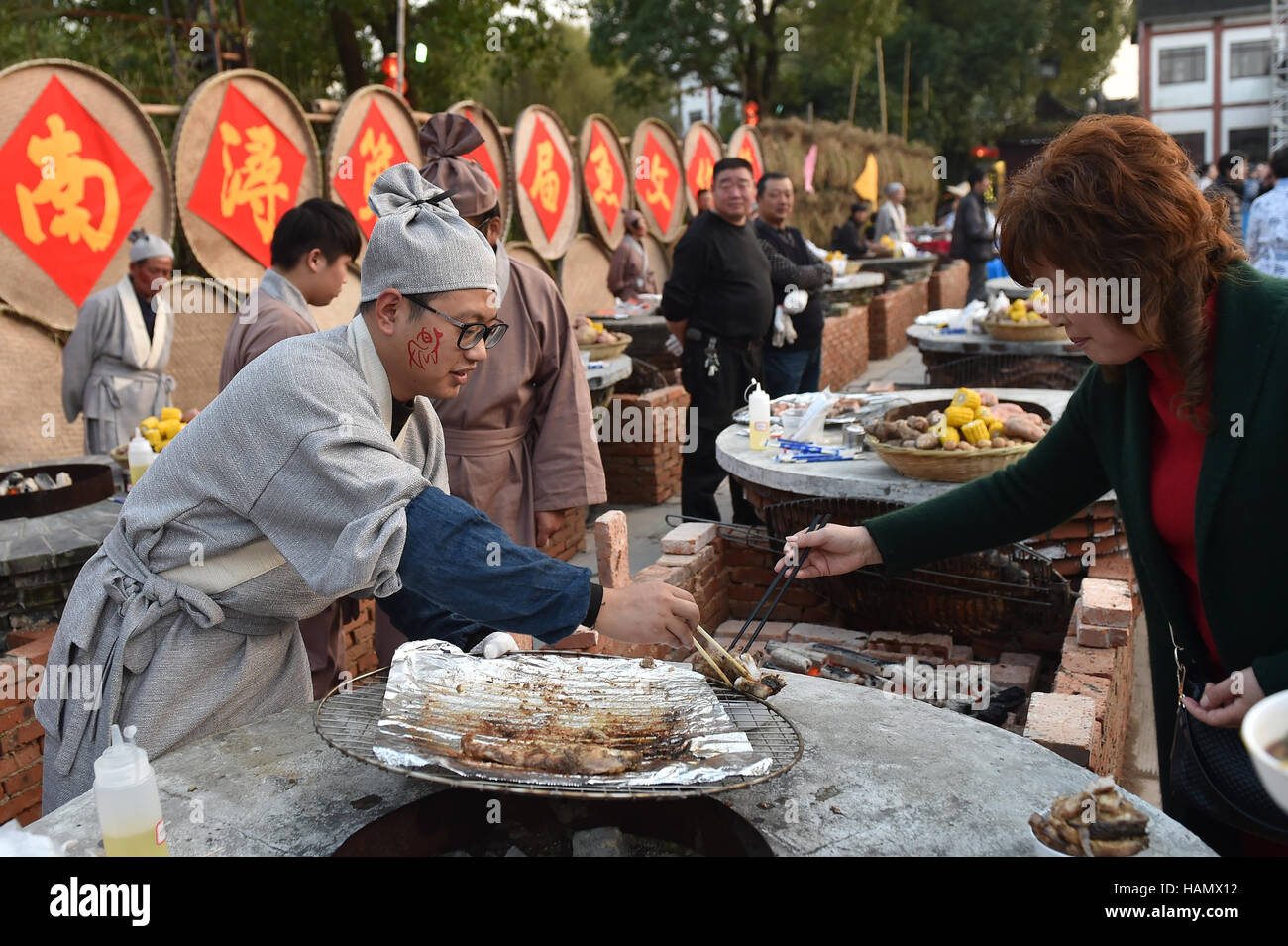 Huzhou, China's Zhejiang Province. 2nd Dec, 2016. A tourist tries ...