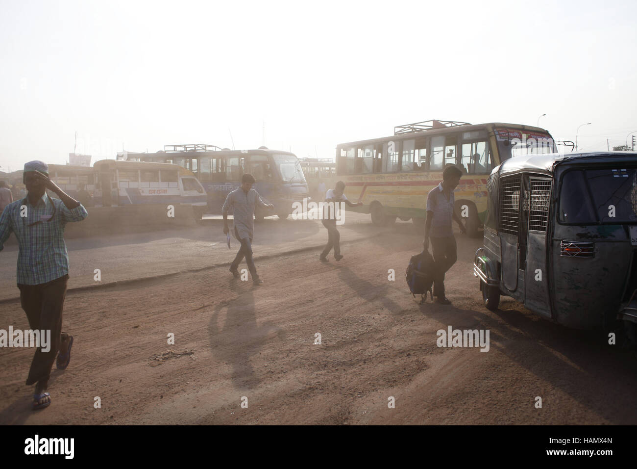 Dhaka, Bangladesh. 2nd Dec, 2016. Bangladeshi people walk along a dust ...