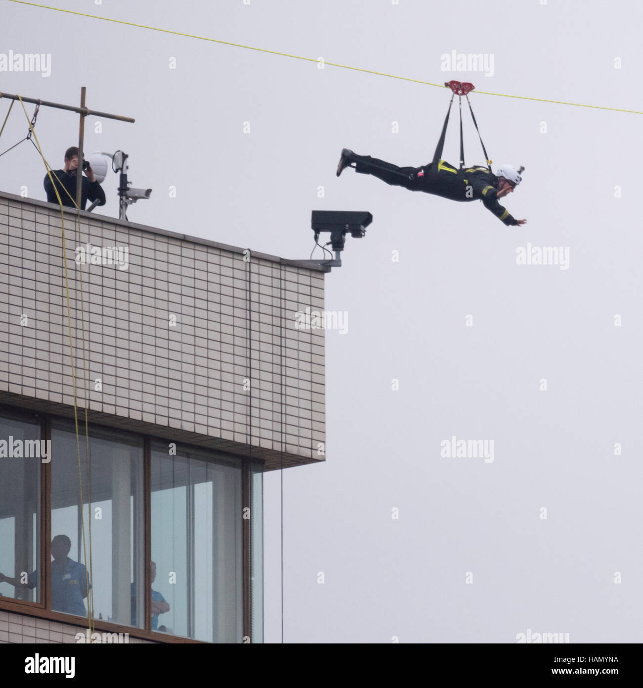 London, UK. 2 December 2016. A participant takes place in a zip-wire ...