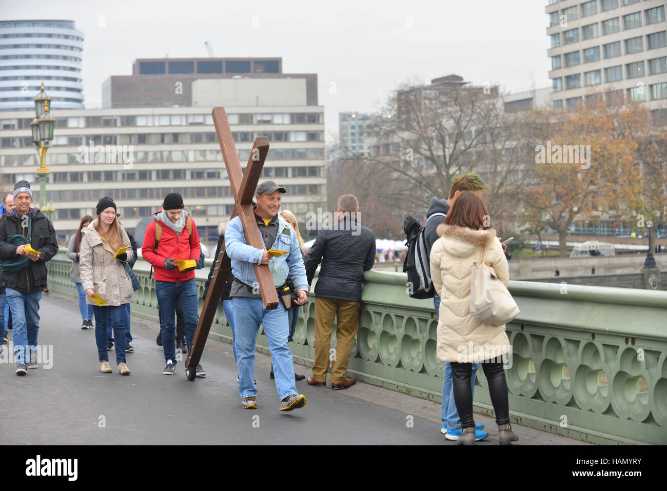 Westminster Bridge, London, UK. 2nd Dec, 2016. A man carrying cross ...