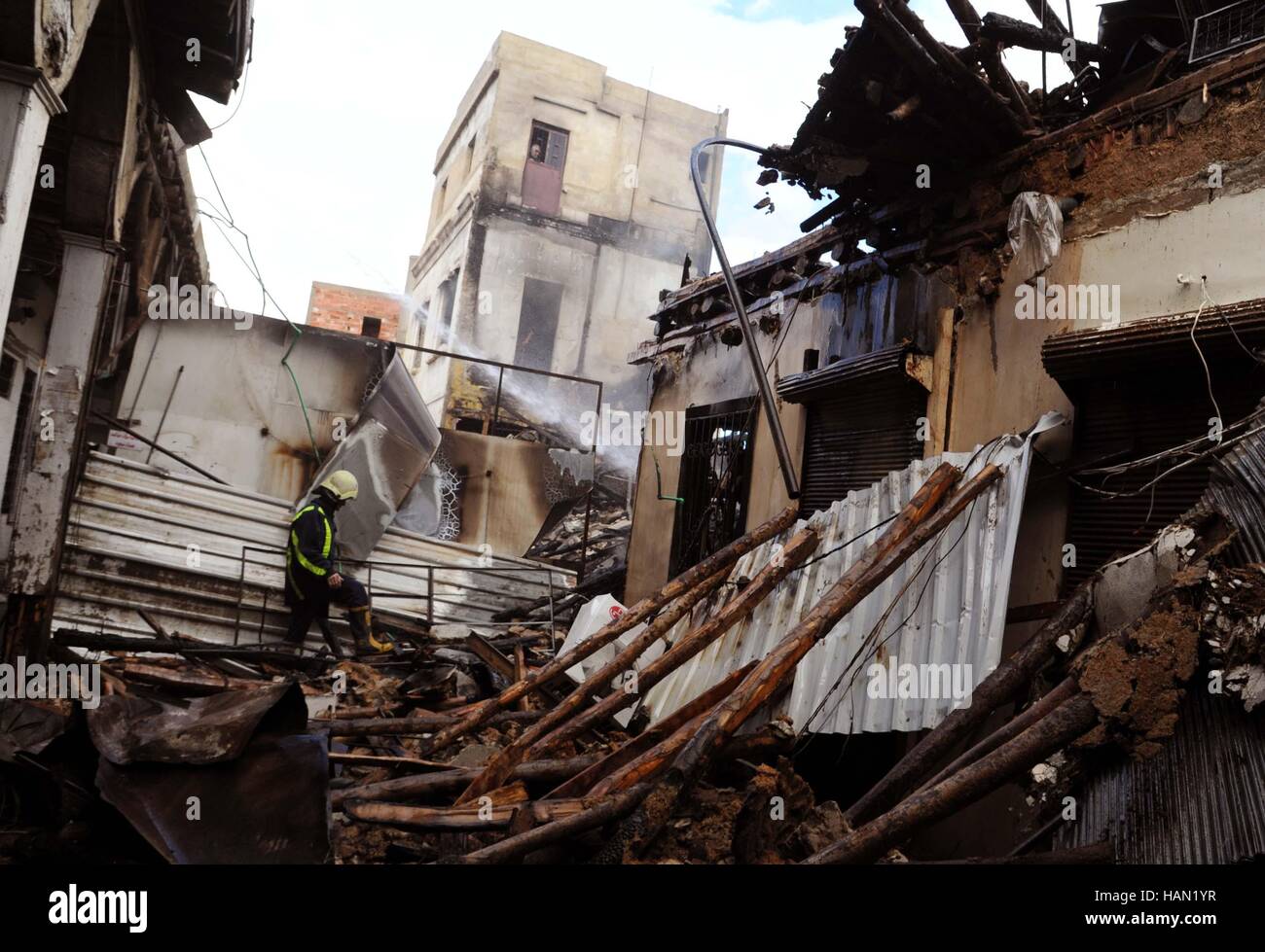 Damascus, Syria. 2nd Dec, 2016. A firefighter inspects the site of a ...