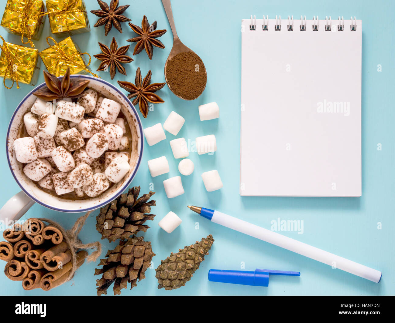 Hot drink with marshmallow and and notebook on blue background Stock ...