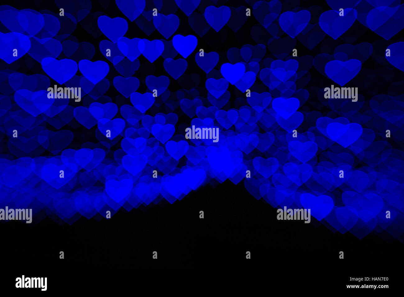 abstract black background with soft blue hearts Stock Photo - Alamy