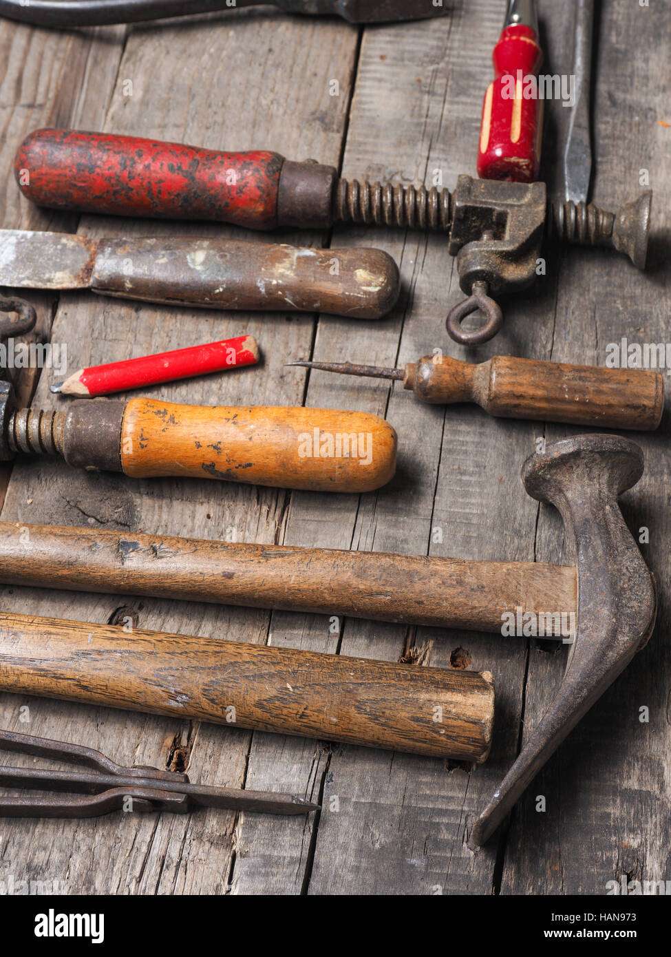 Old rusty tools on a used workbench, industrial background Stock Photo ...