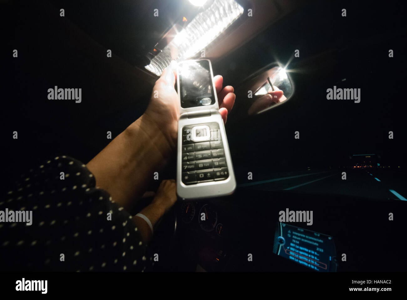 woman making a call while husband driving on highway Stock Photo - Alamy