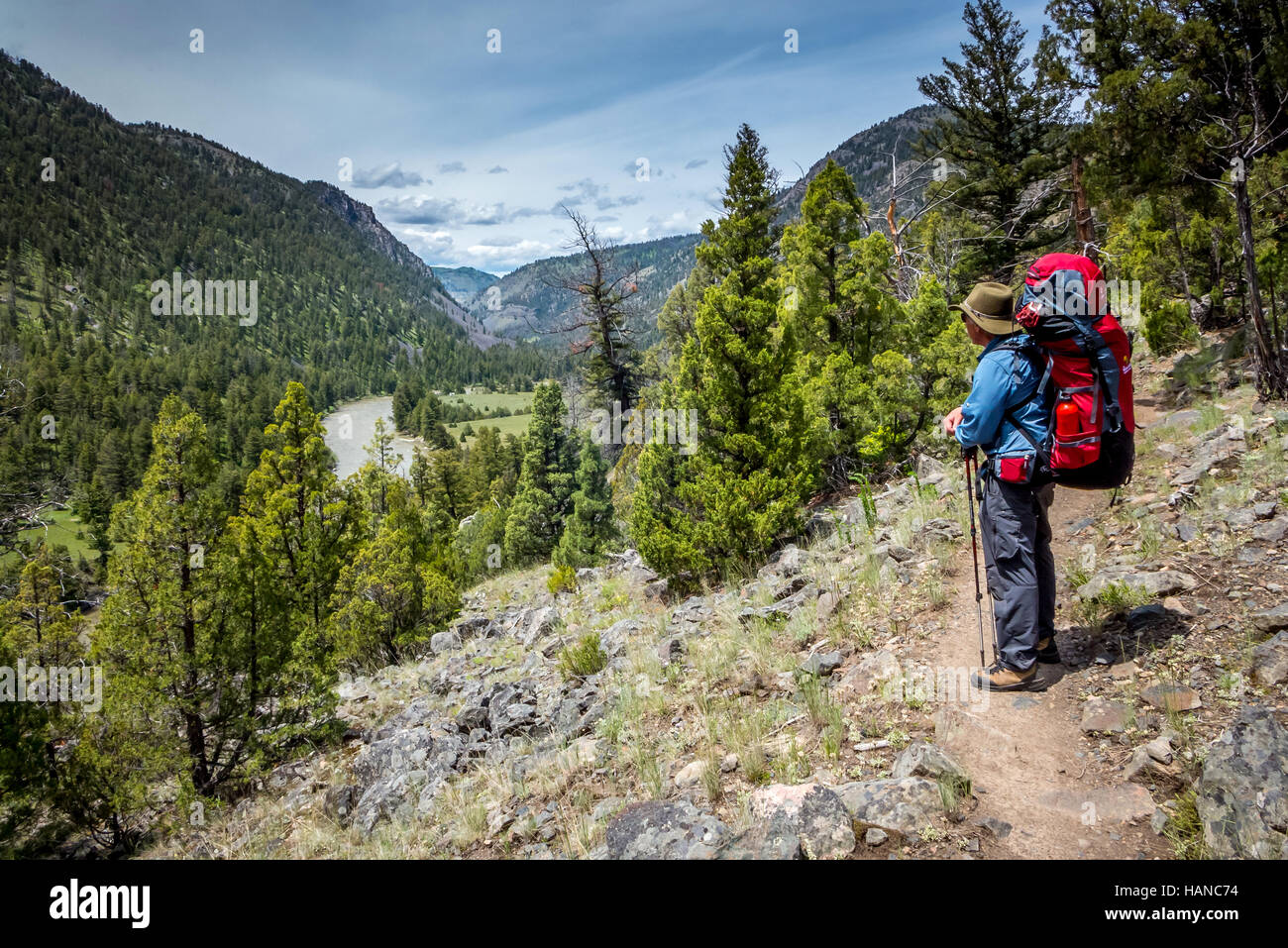 Hikers making their way through the wilderness on the Hellroaring Creek ...