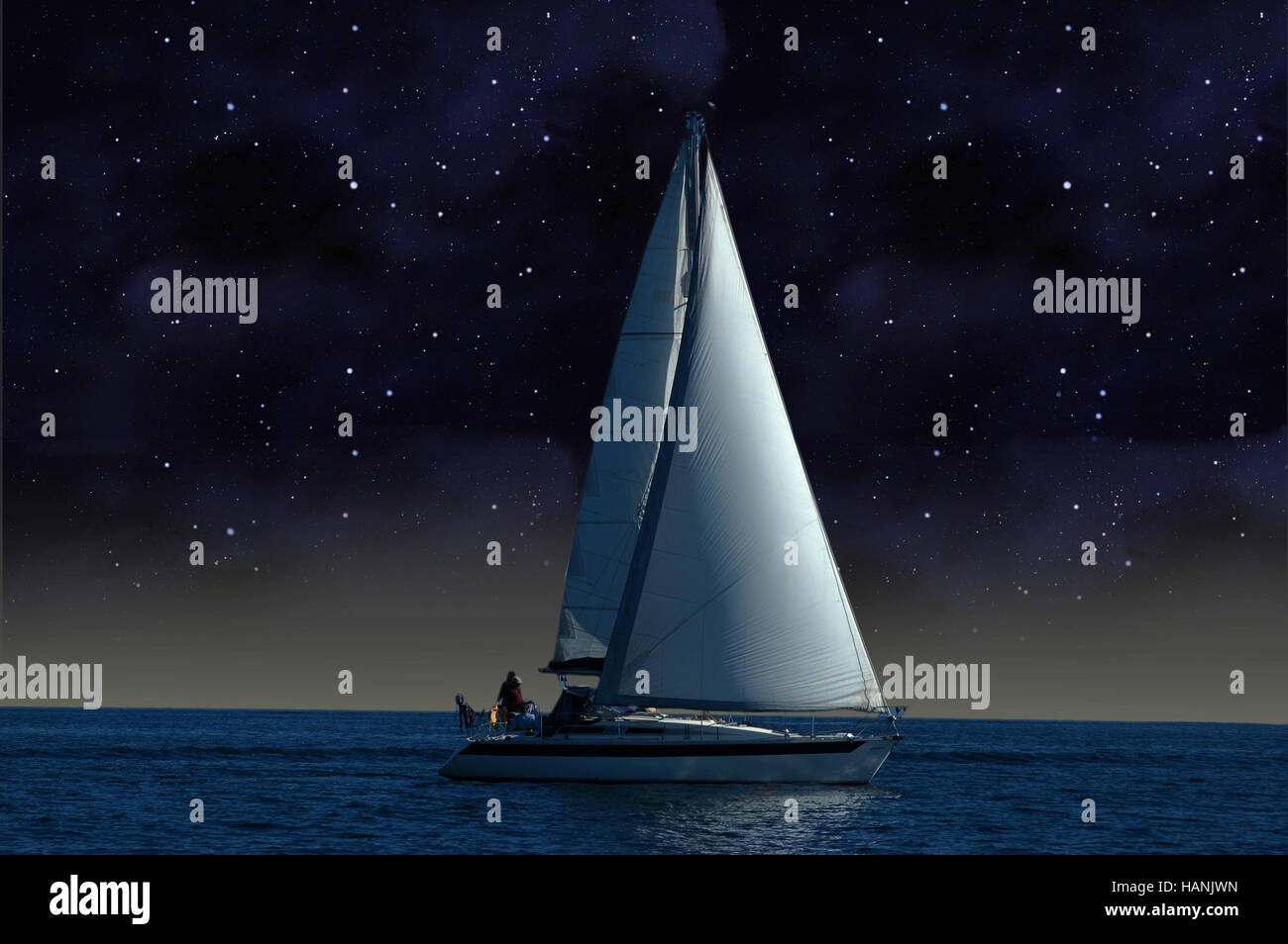 A sailboat sails under the starry sky Stock Photo - Alamy