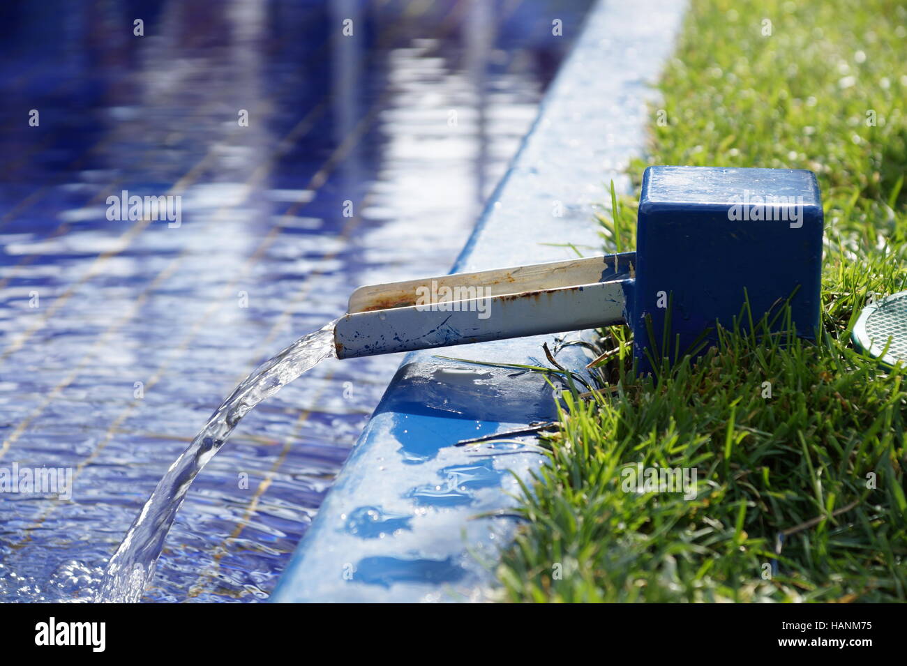 Detail from open air swimming pool, steel tap with running water Stock ...