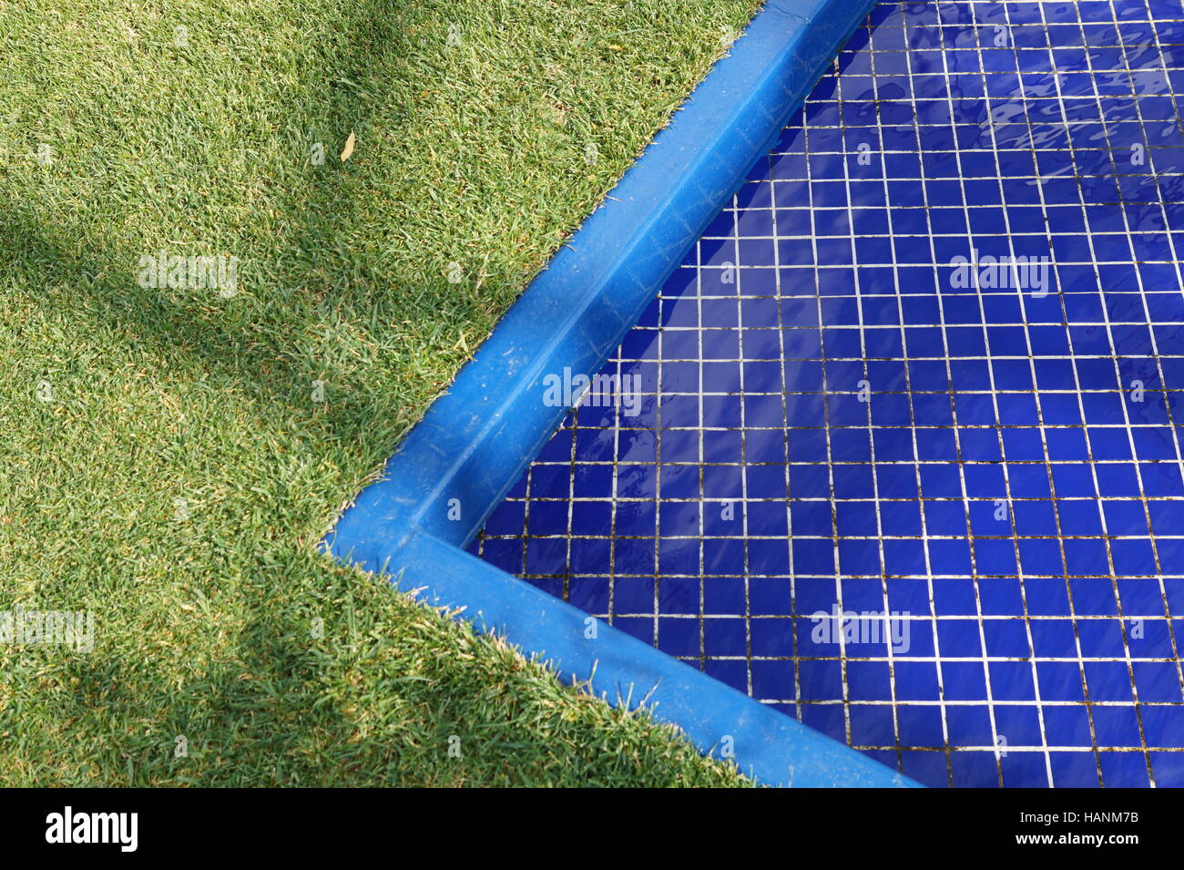 Detail of the steps to enter a swimming pool Stock Photo - Alamy